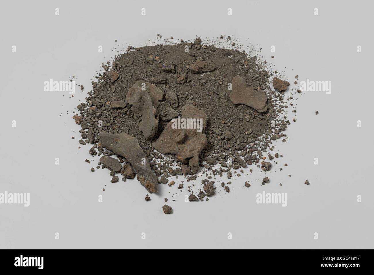 Fragments and grit from tin from the wreck of the East India Hollandia ...