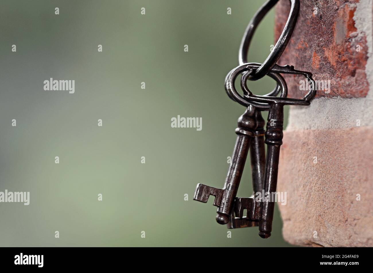Key ring with old keys hanging on a wall, Germany Stock Photo - Alamy