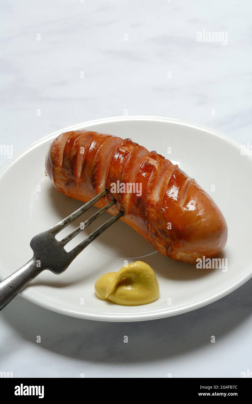 Fried sausage with mustard on plate, meat sausage, Germany Stock Photo ...