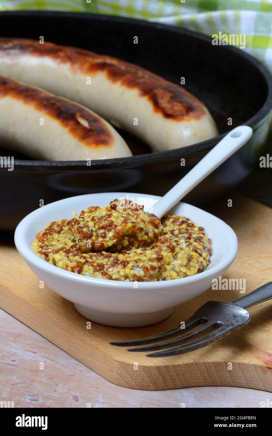Bowl of Dijon mustard and sausages, Germany Stock Photo - Alamy