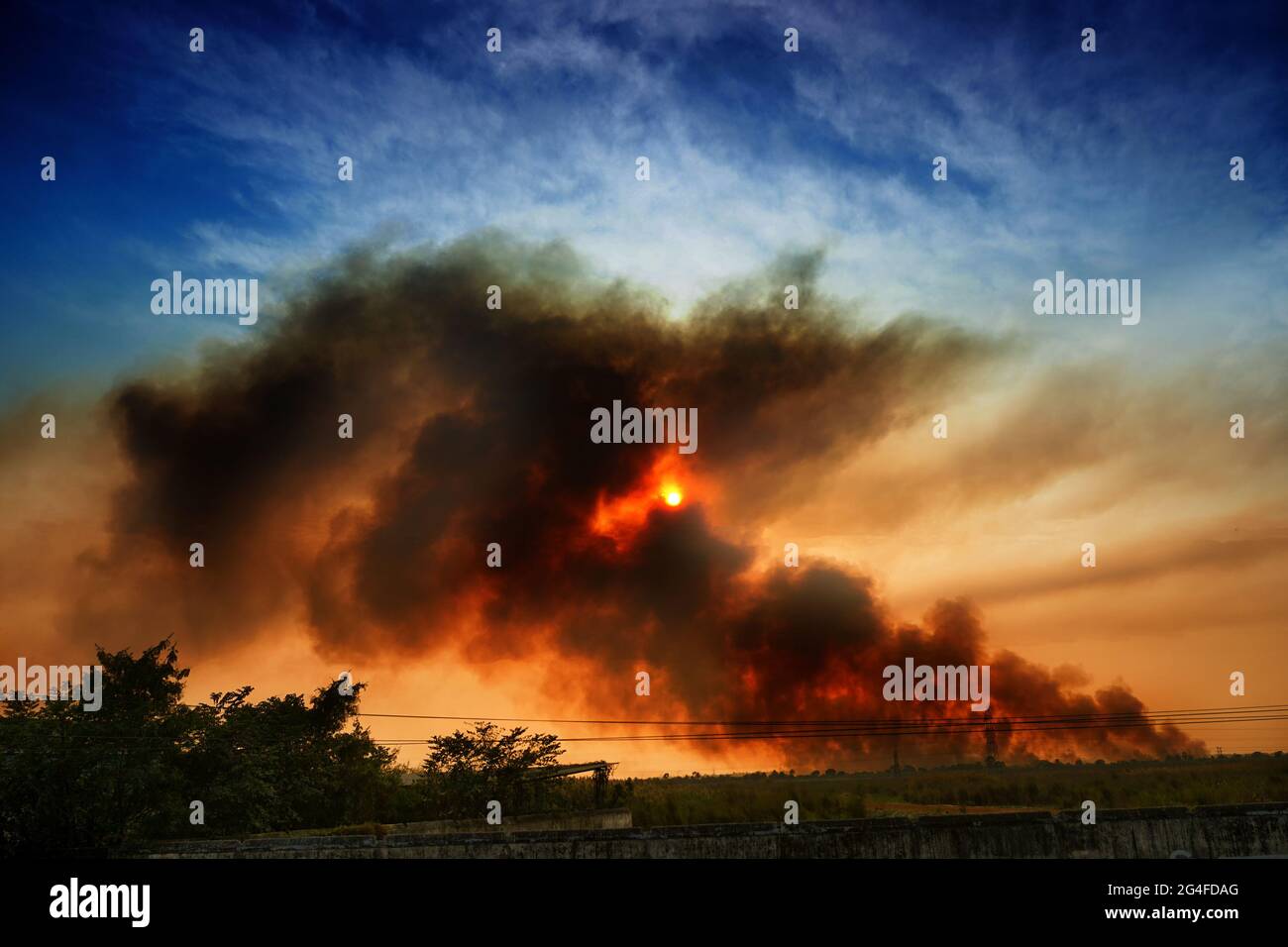 Industrial pollution is spreading like clouds and covering the setting ...