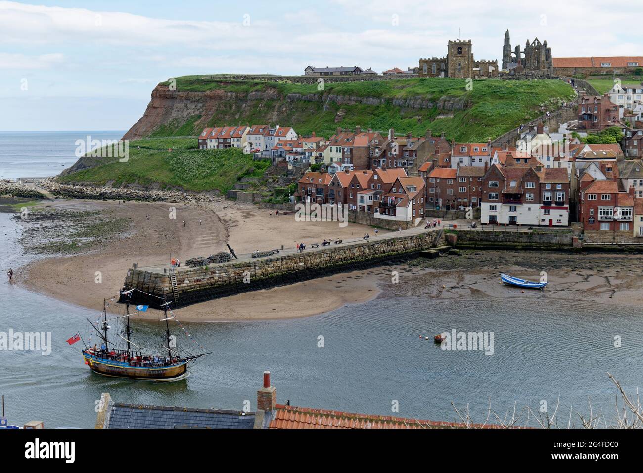 The ruins of Whitby Abbey overlook the River Esk as it exits the ...