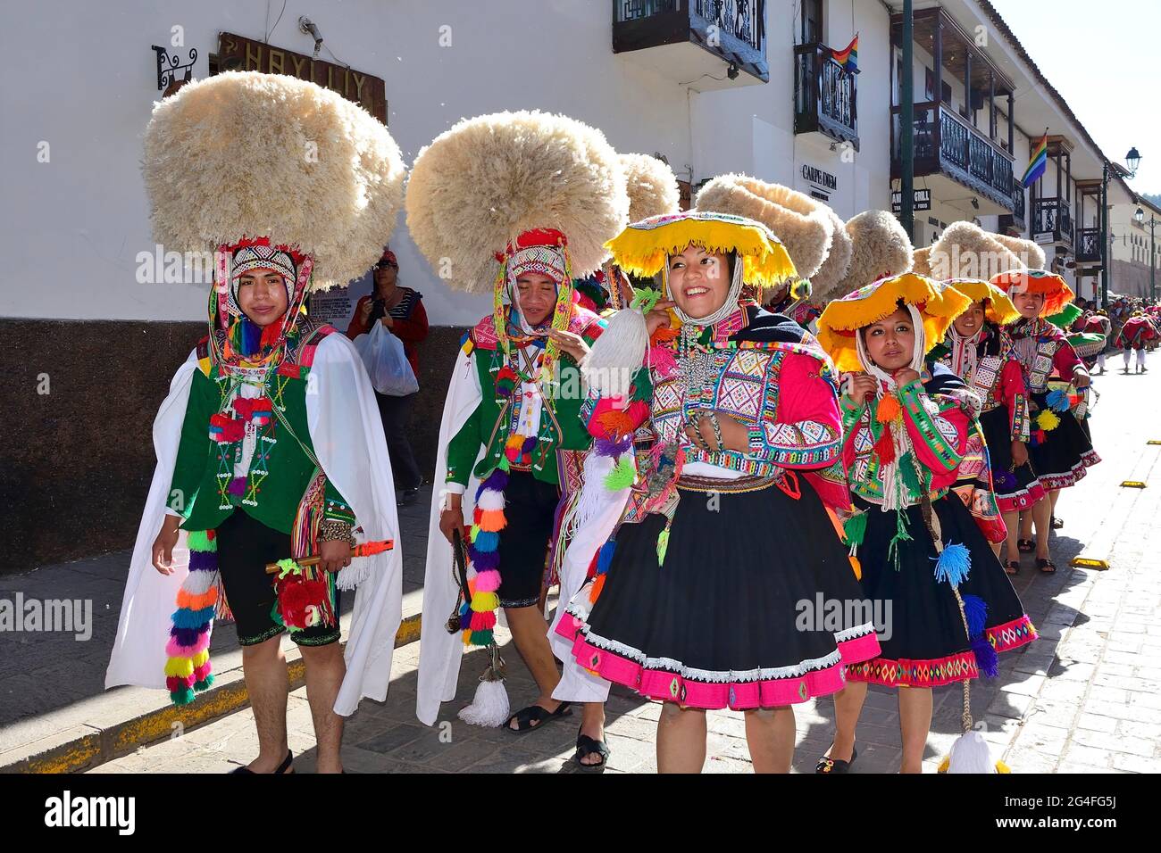 Indigenous dance group in colorful traditional costume in the old town ...