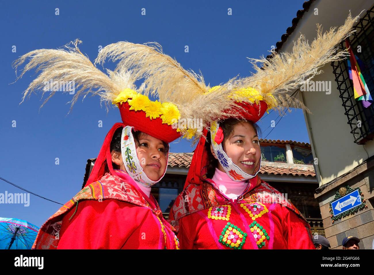Two indigenous woman in traditional traditional costume with headdress ...