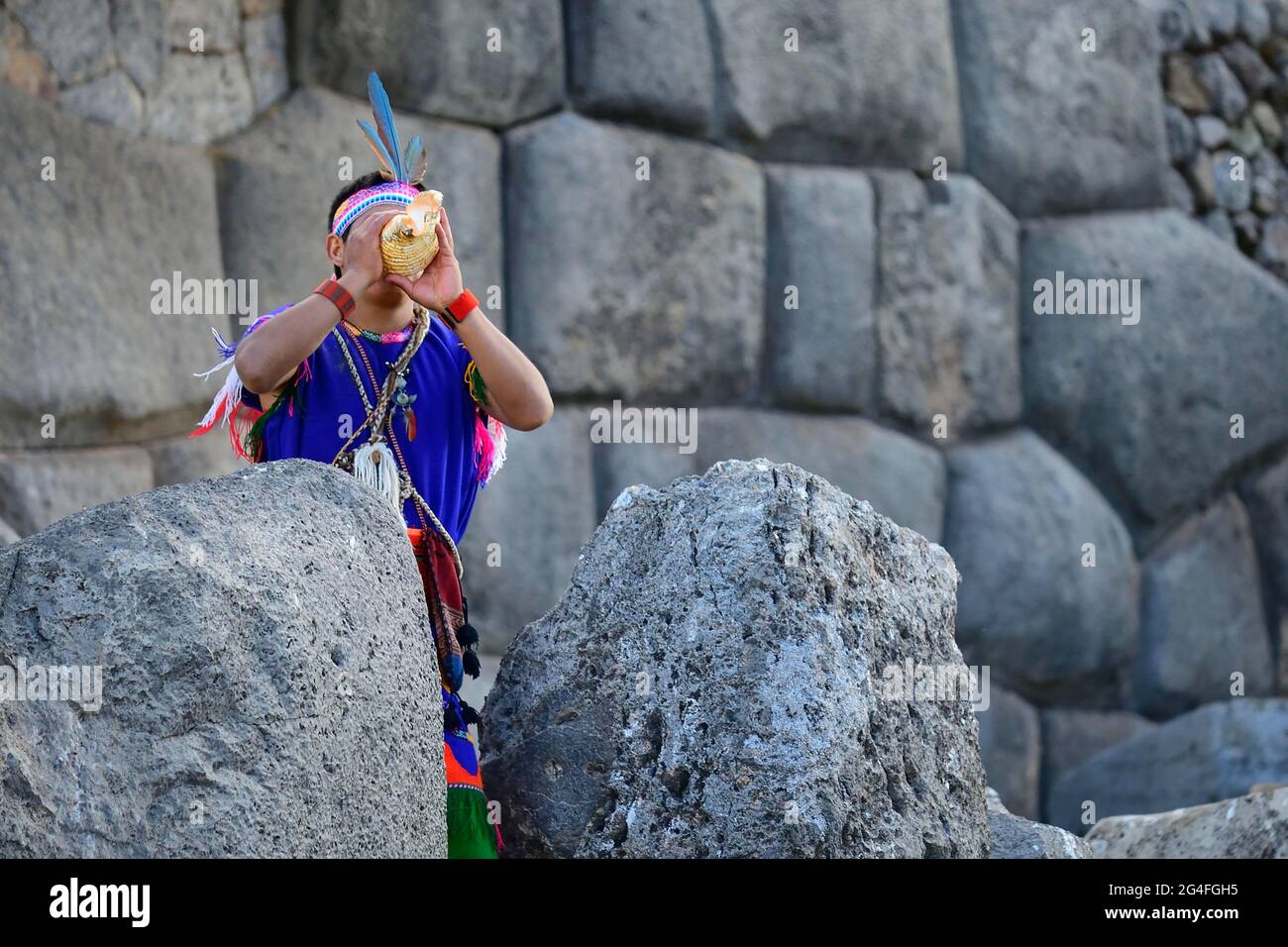 Inti Raymi, festival of the sun, young man blowing the conch shell at ...