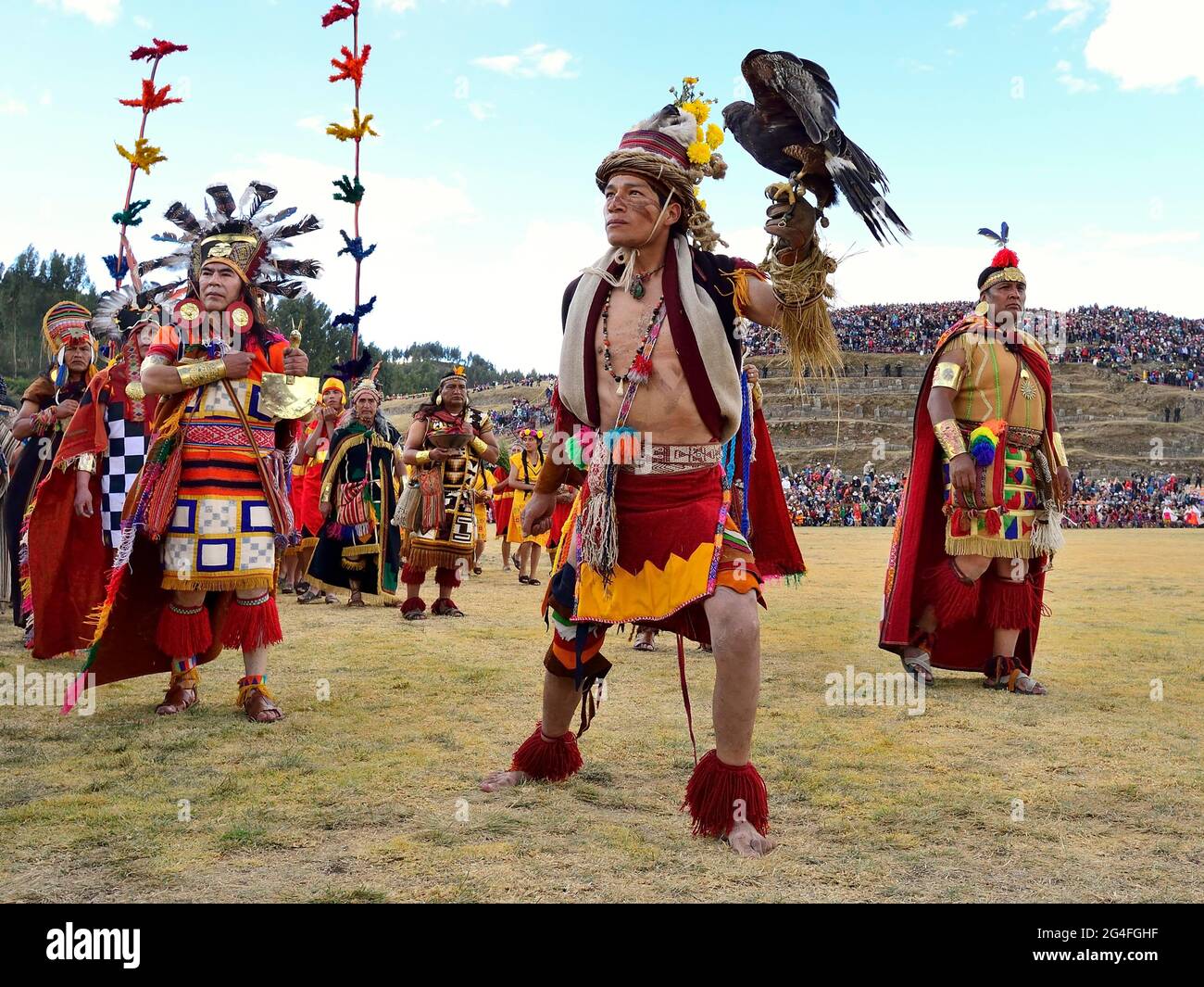 Inti Raymi, feast of the sun, young man with bird of prey, ruins of the ...