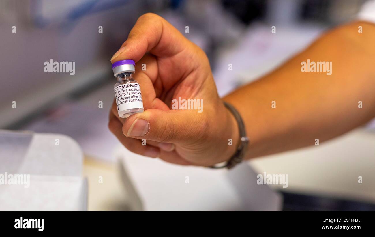 Pharmacist holding Corona vaccine Comirnaty from BioNTech Pfizer ...