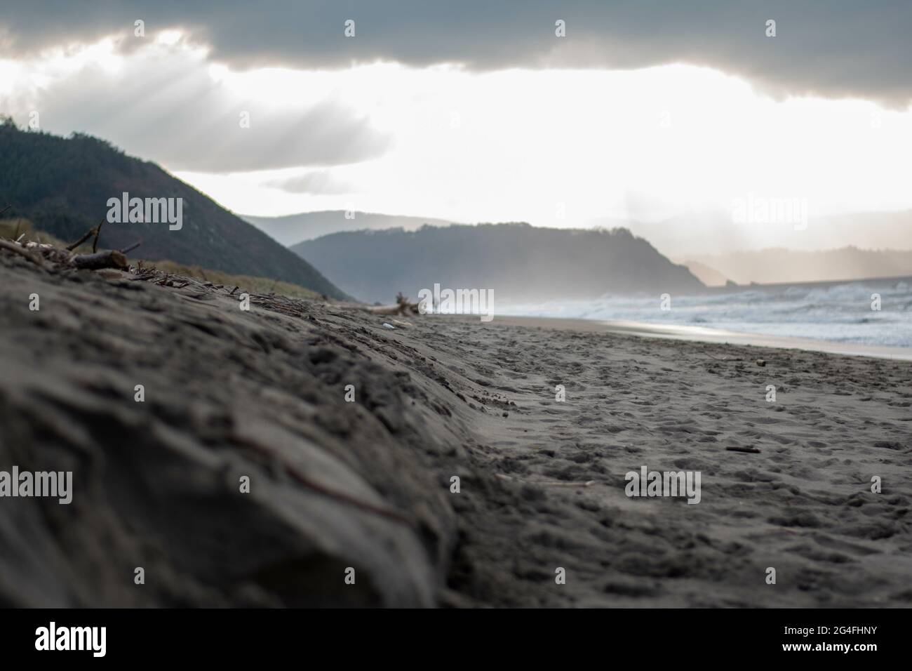 A glorious scenery of the sandy beach at a golden sunset Stock Photo ...