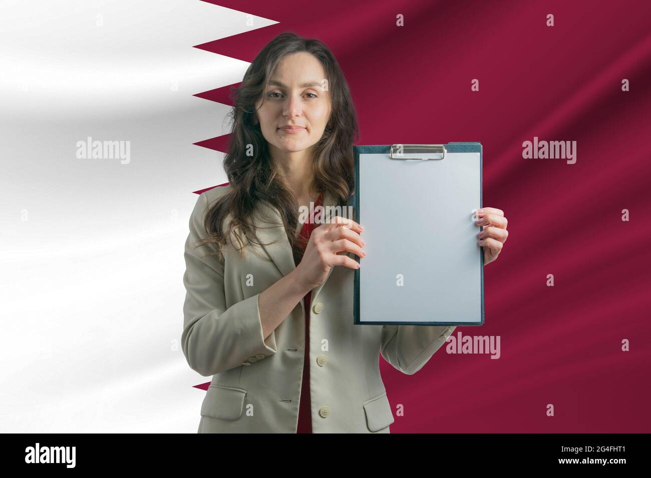 Study in Qatar Beautiful woman holding a sheet of paper in her hands ...