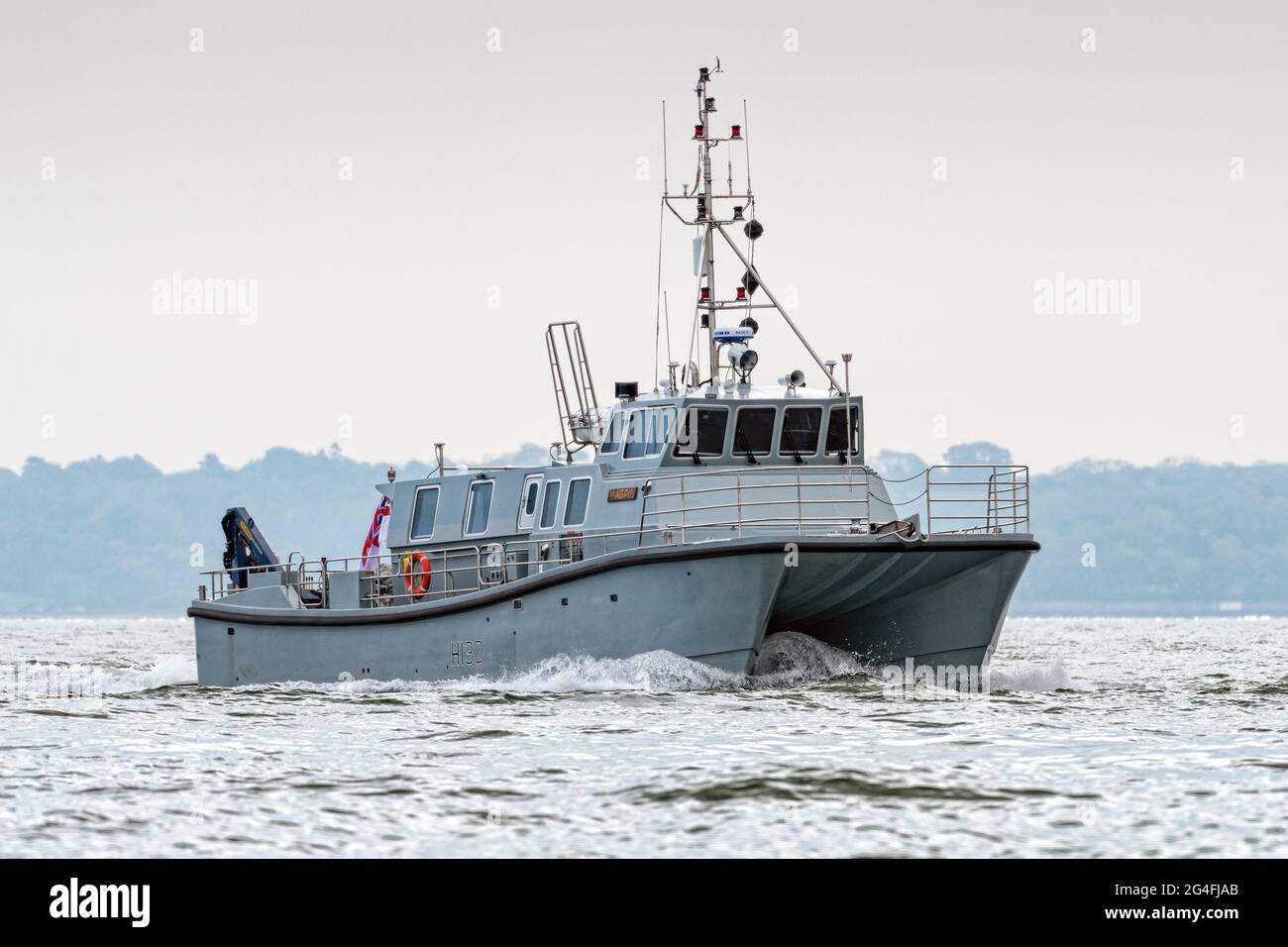 The Royal Navy hydrographic survey vessel HMS Magpie (H130) approching ...