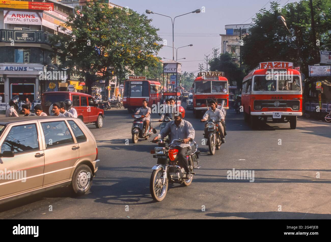 KERALA, INDIA - Buses and scooters on street Stock Photo - Alamy