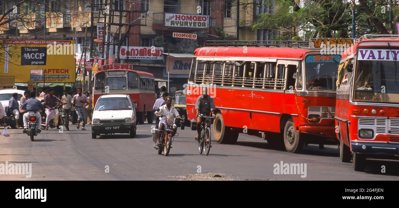 KERALA, INDIA - Buses and scooters on street Stock Photo - Alamy