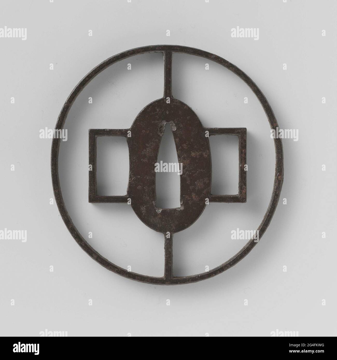 . Oval tsuba with a simple openwork decoration of a vertical line and a ...