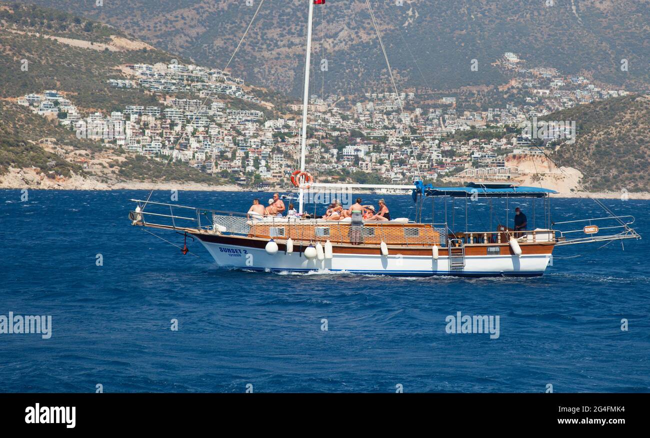 Kalkan, Turkey, 2020. A small charter yacht ( sunset 2 ) sails across ...