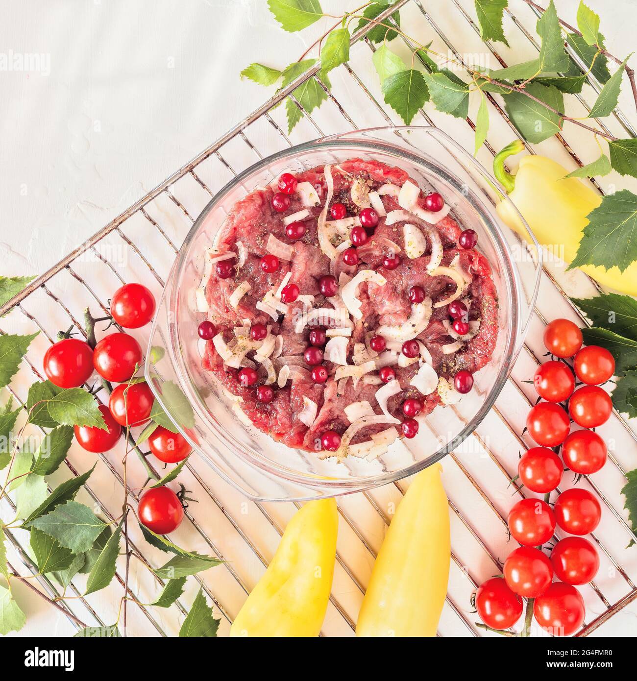 Cooking meat with farm vegetables in the open air. The concept of a ...