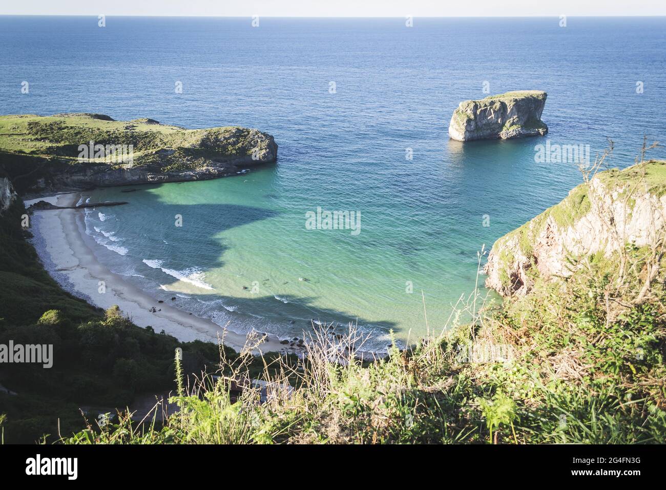 A beautiful tropical beach of the Playa de Andrin in Spain Stock Photo ...