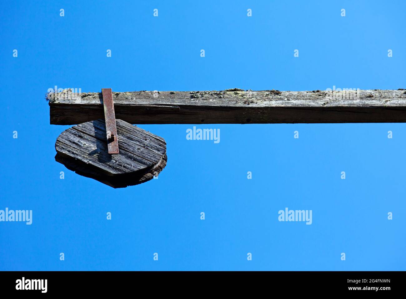 an ancient wooden winch used to hoist grain Stock Photo - Alamy