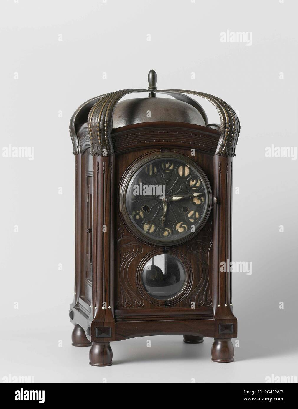. Chimney clock from Coroland wood. Design J. van den Bosch Stock Photo ...