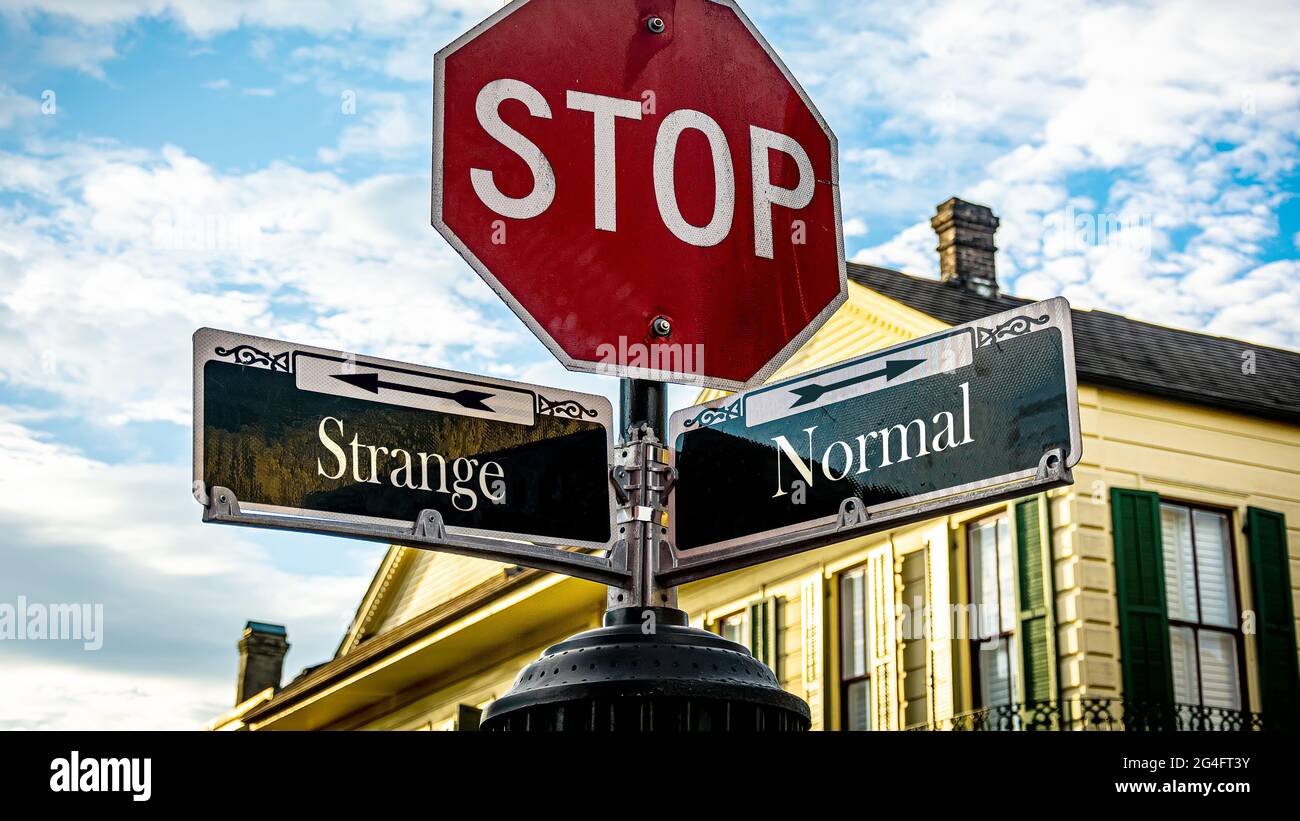 Street Sign the Direction Way to Normal versus Strange Stock Photo - Alamy