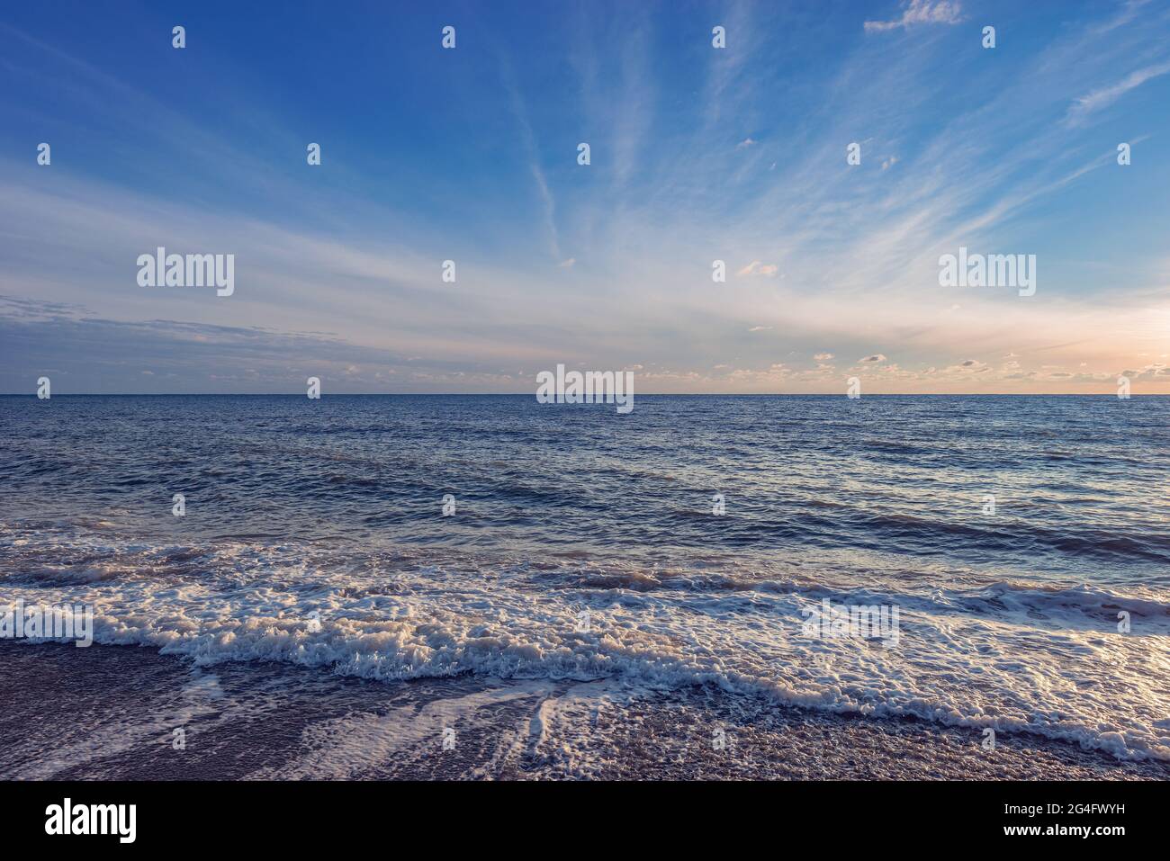 Sunset view of the sea coast at summer time Stock Photo - Alamy
