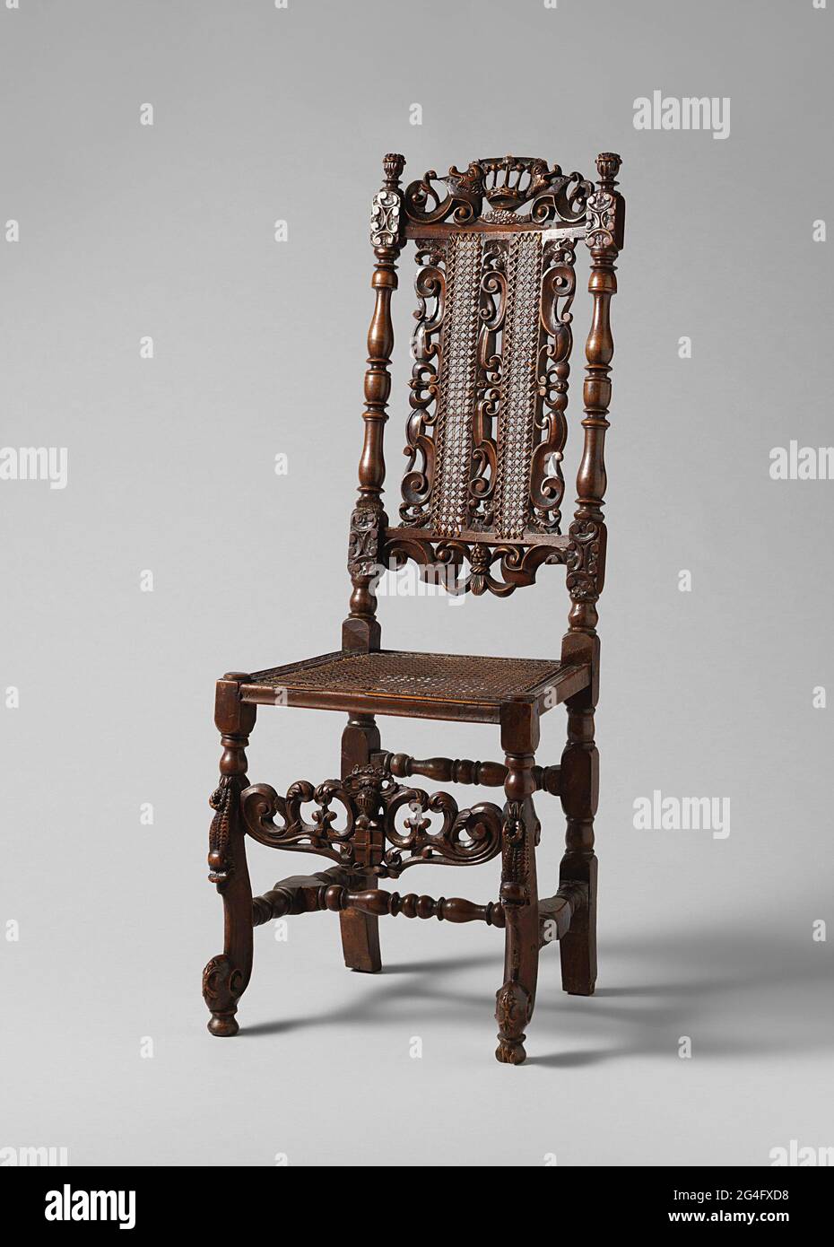Chair with cane, S-shaped front and hind legs with dolphins. Upper sump ...