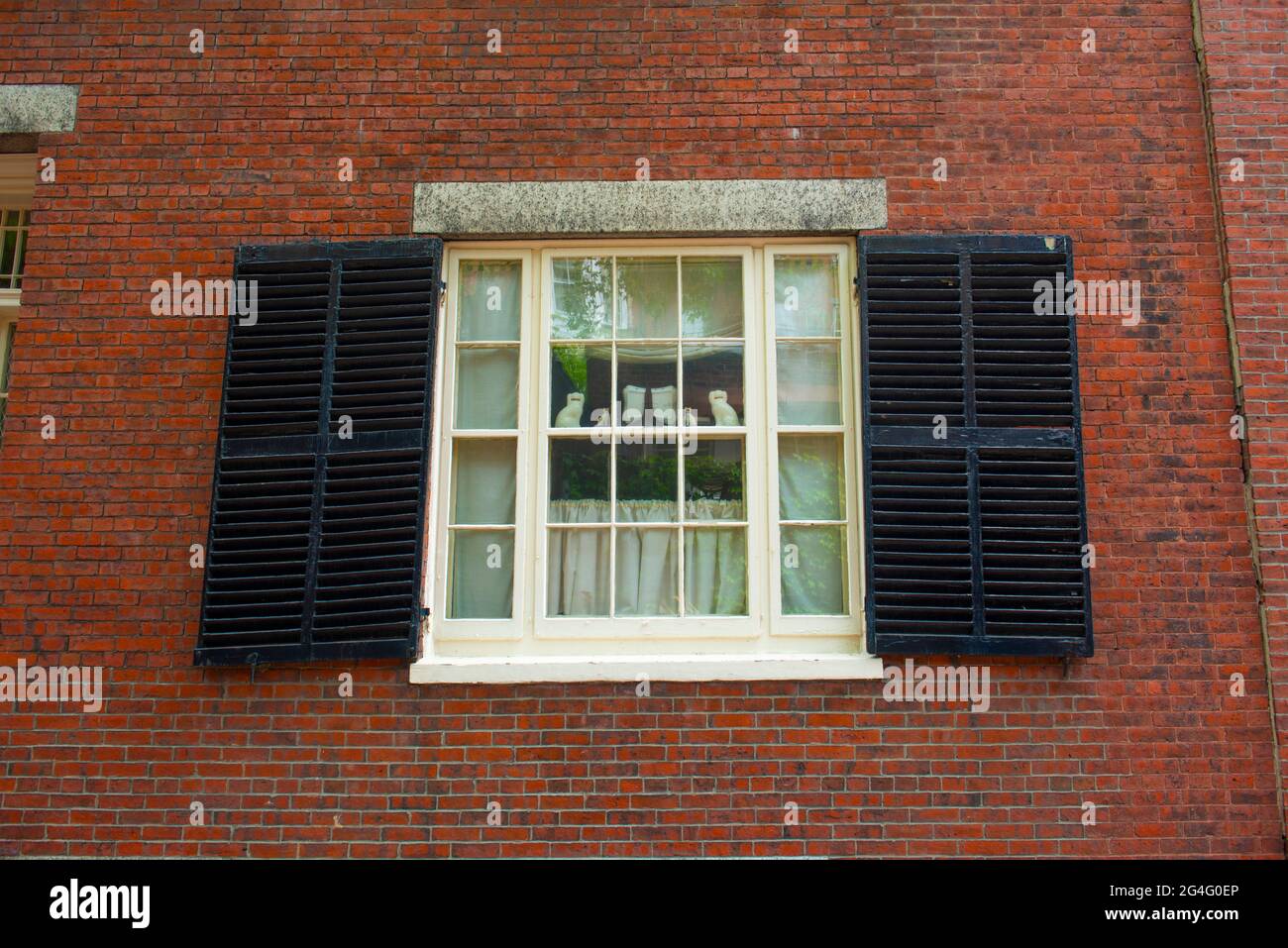 Antique window on the historic row houses on Acorn Street on Beacon ...