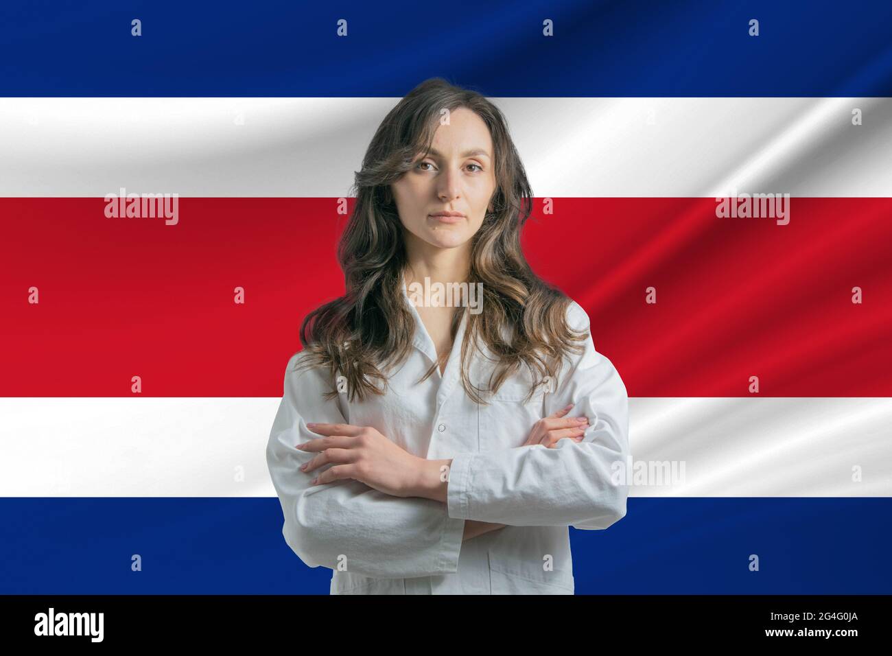 Medicine in Costa Rica Happy beautiful female doctor in medical coat ...