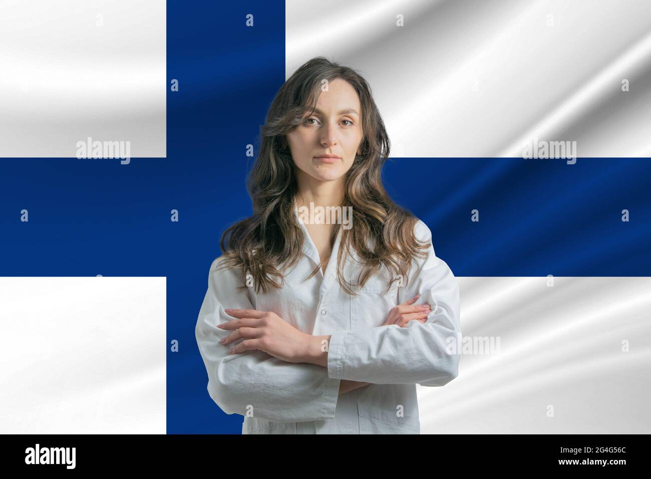 Medicine in Finland. Happy beautiful female doctor in medical coat ...