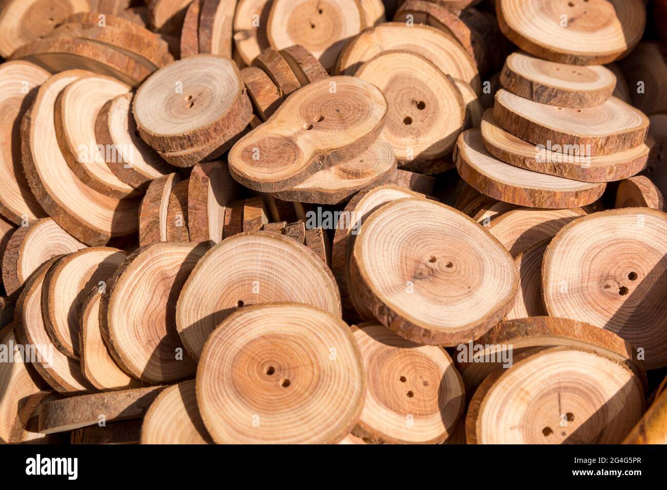 Auning, Denmark - 19 June 2021: Buttons for clothes made of wood in the ...
