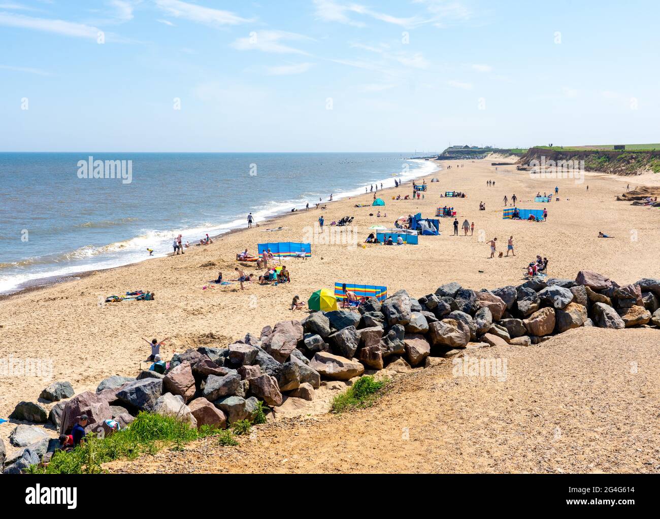 Sunny beach full of holidaymakers from clifftop at Happisburgh on the ...