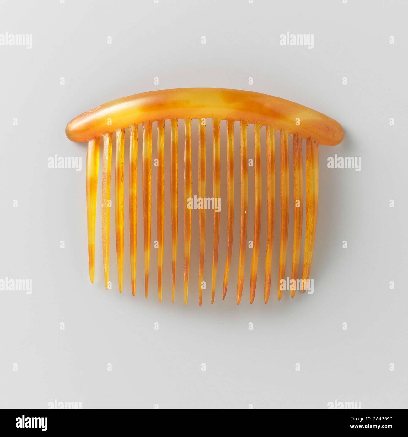 . Hair comb of blonde imitation turtle with solid narrow slightly ...