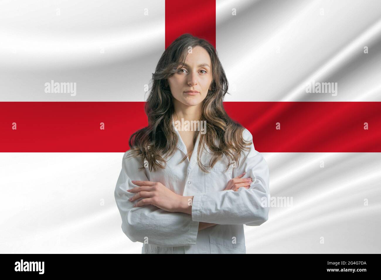 Medicine in England. Happy beautiful female doctor in medical coat ...