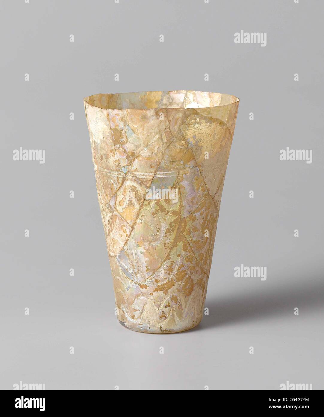 . Strongly irradiated, colorless cup with flat bottom and straight ...