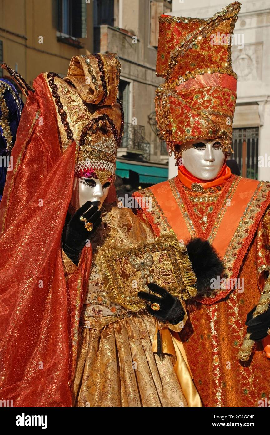 Venice, Italy - February 21st 2009. Carnival goers pose for photographs ...