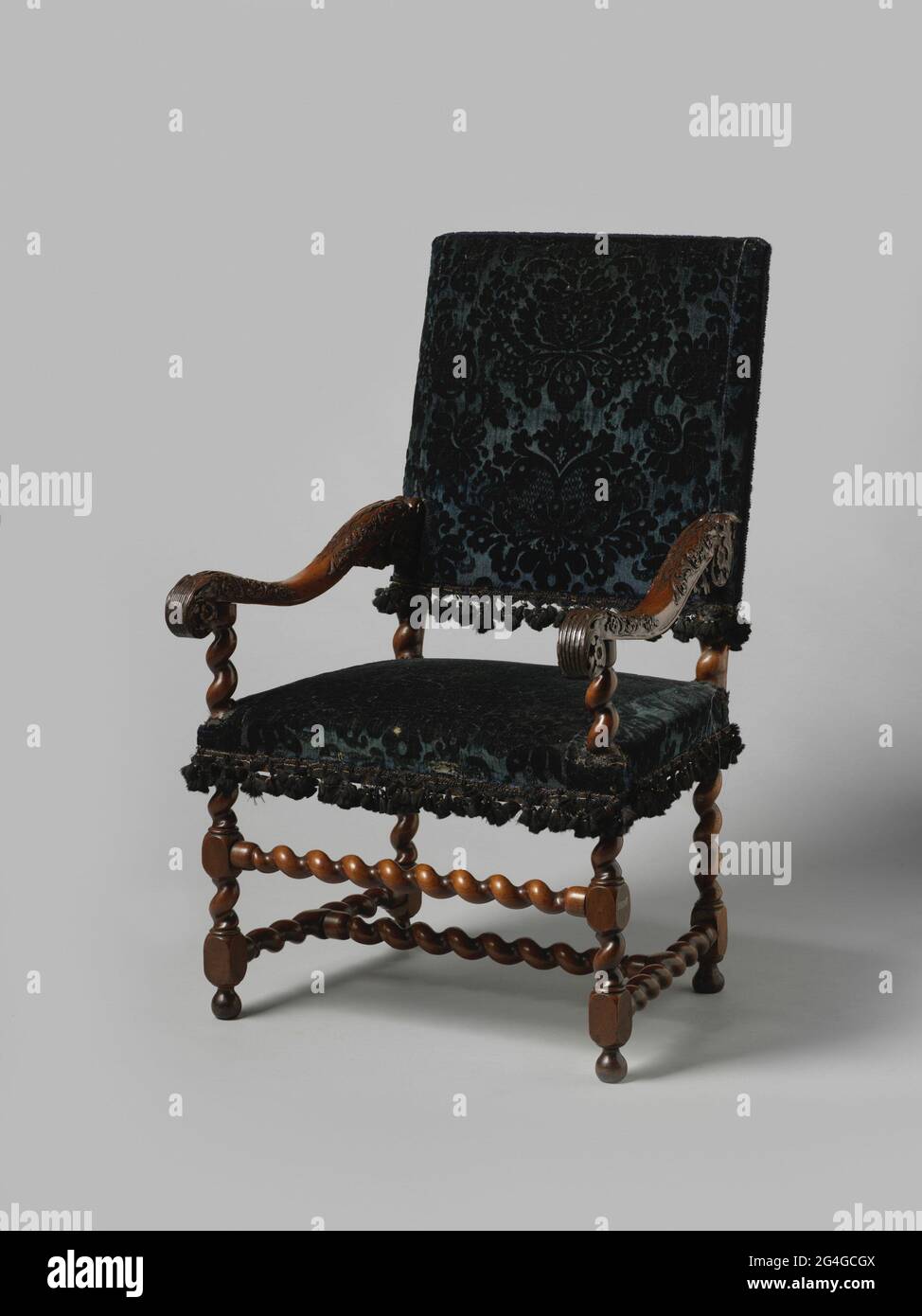 Armchair with swapped legs, covered with black, hammered velvet with a ...