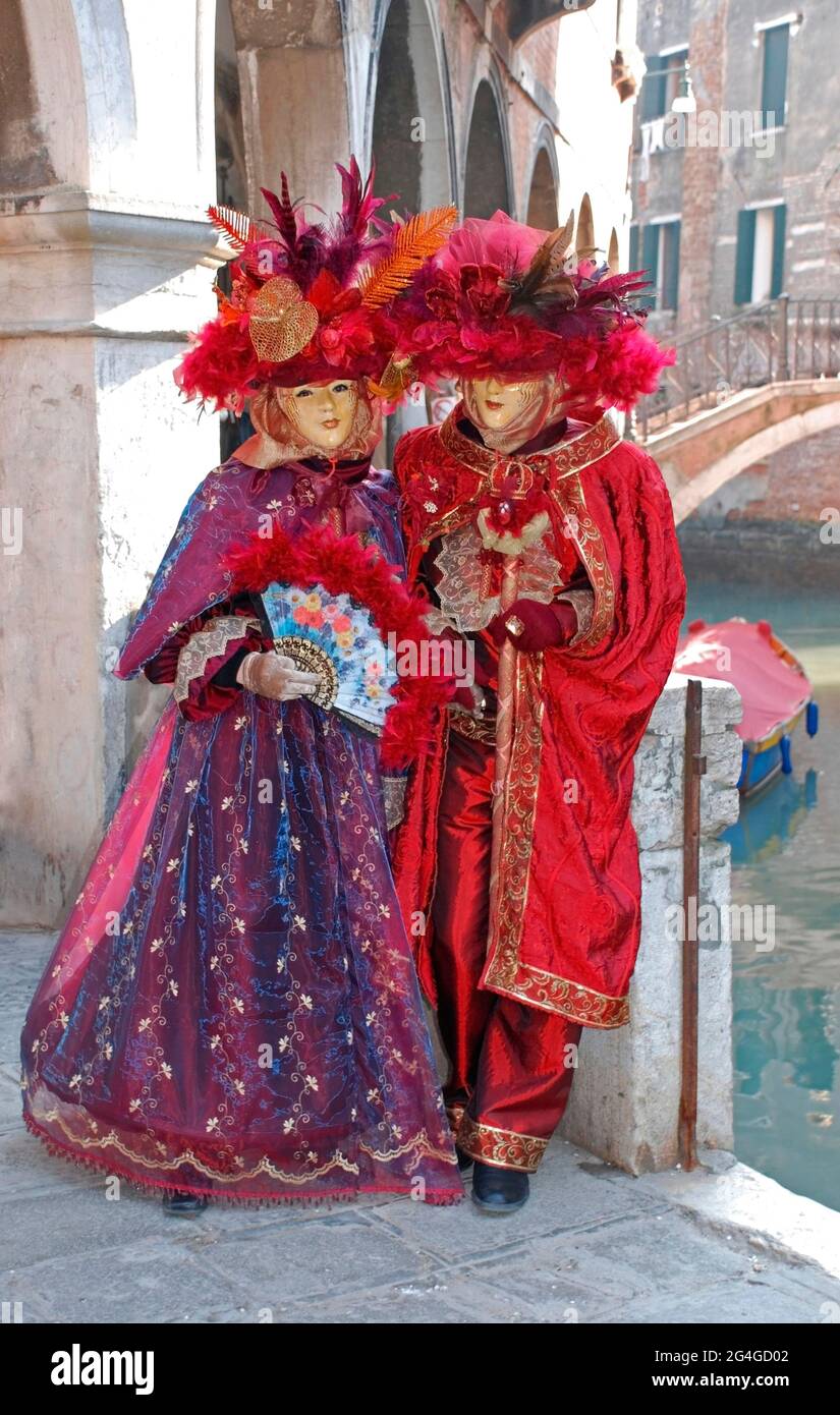 Venice, Italy - February 21st 2009. Carnival goers pose for photographs ...