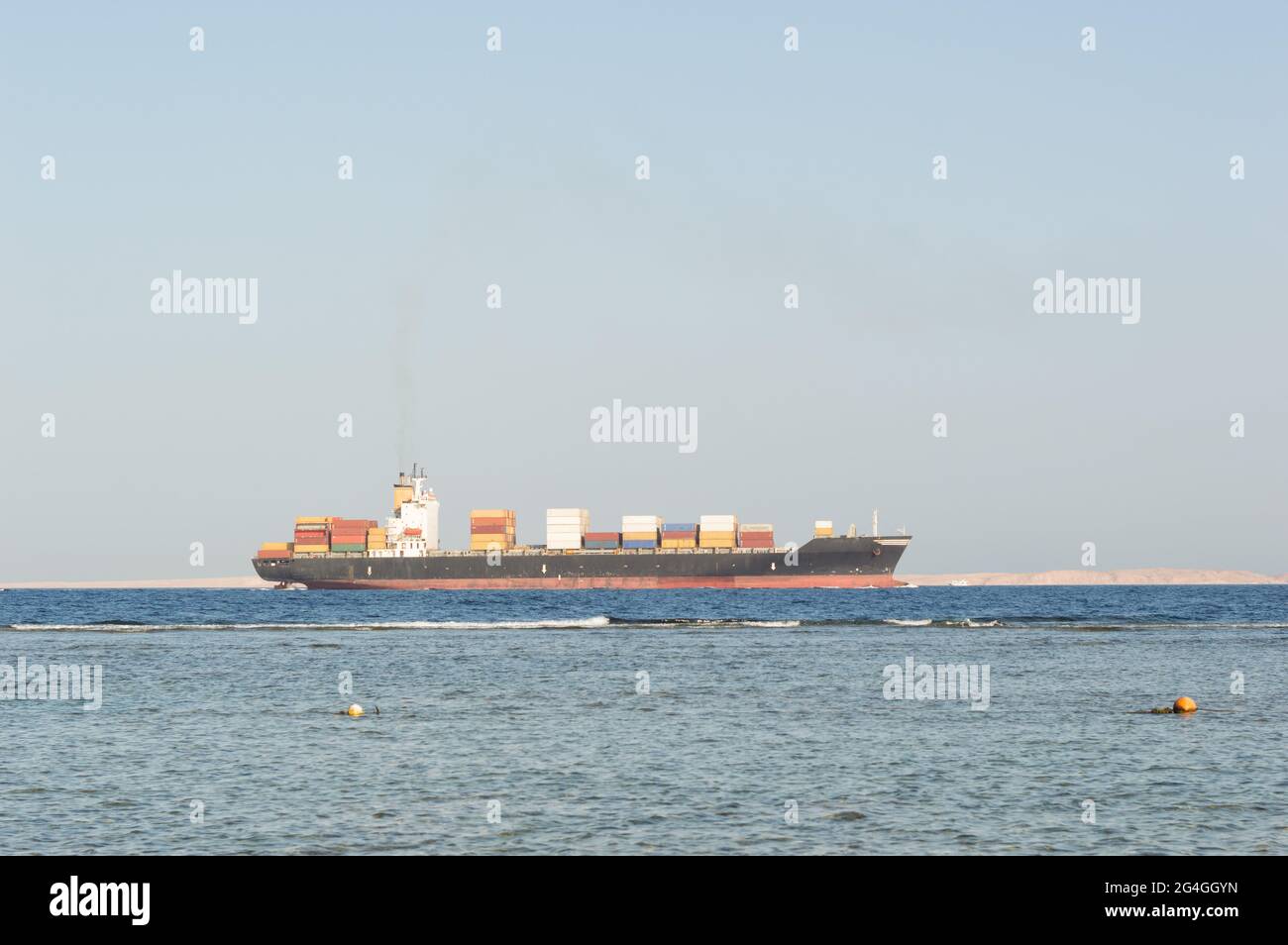Cargo ship at sea Stock Photo - Alamy