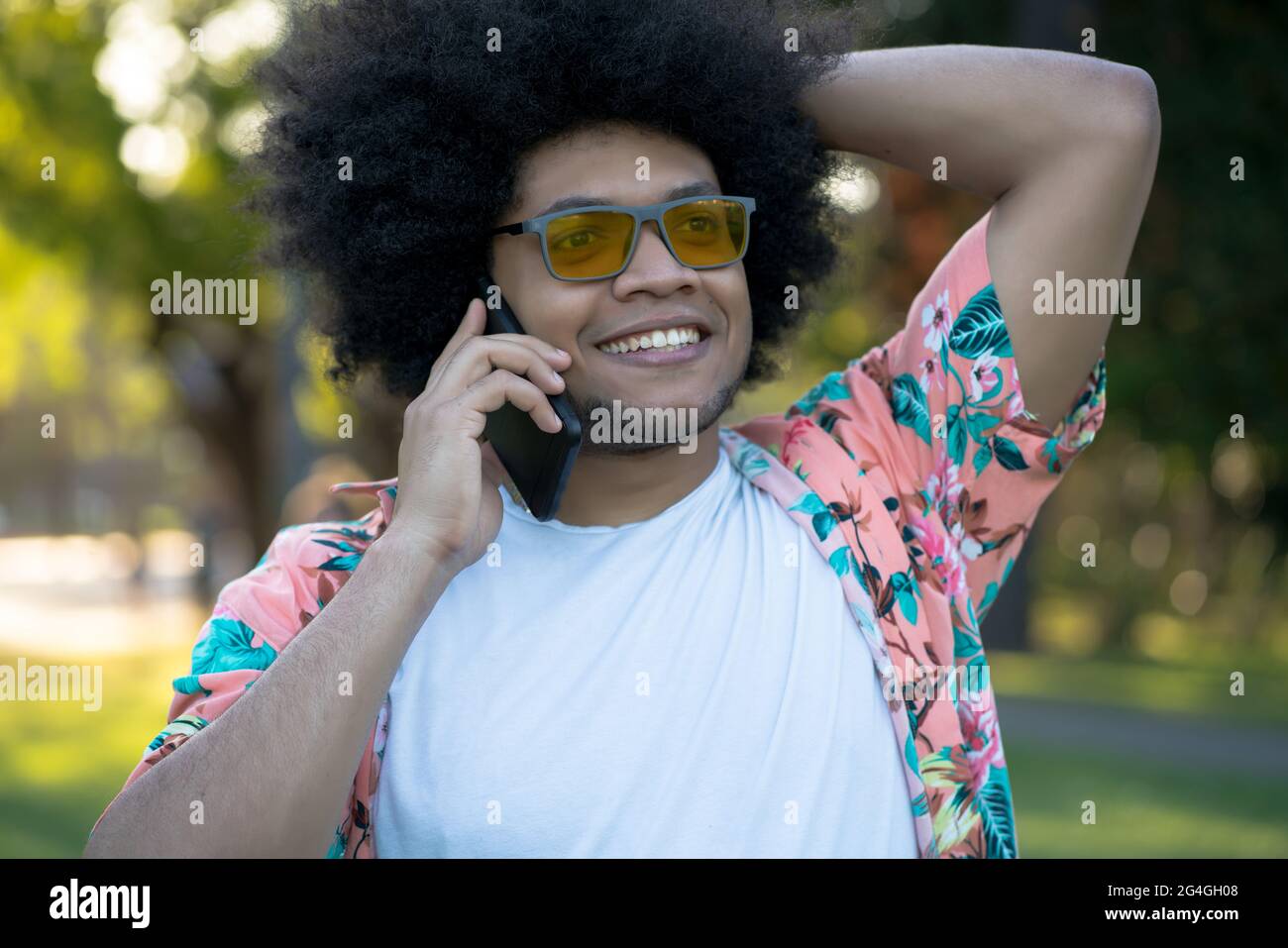 Latin man smiling outside hi-res stock photography and images - Alamy