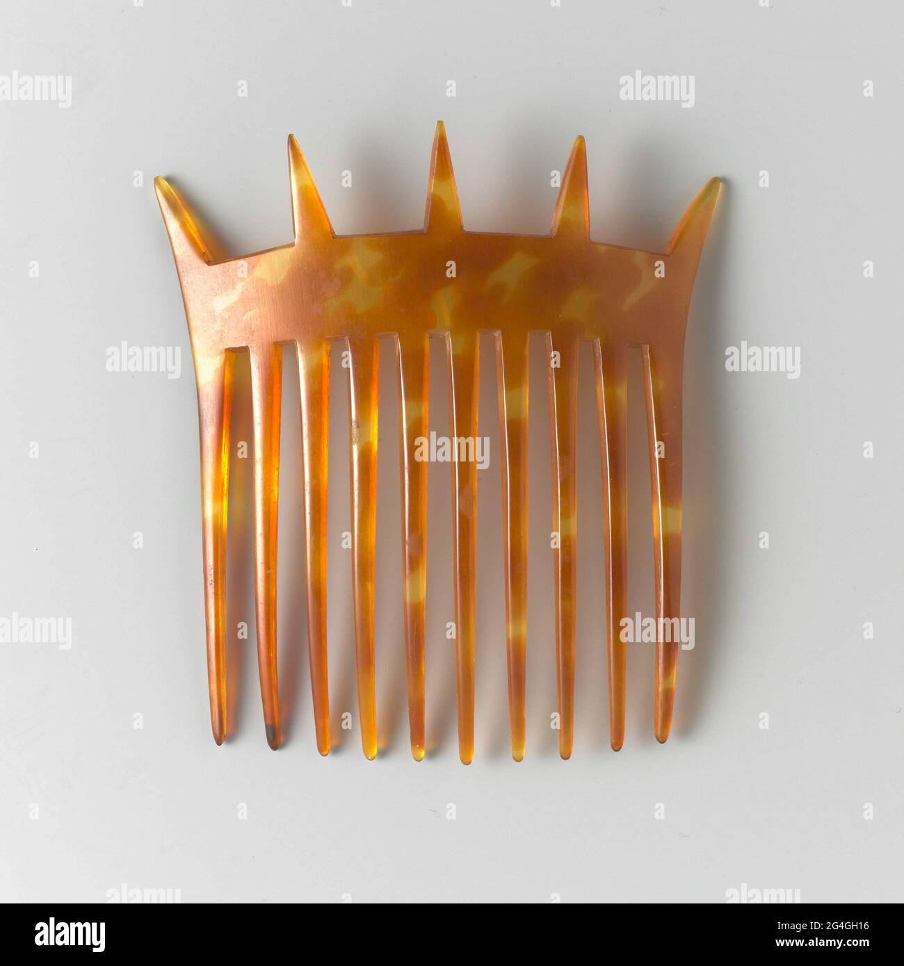 . Hair comb of blonde imitation turtle or horn with narrow, smooth back ...