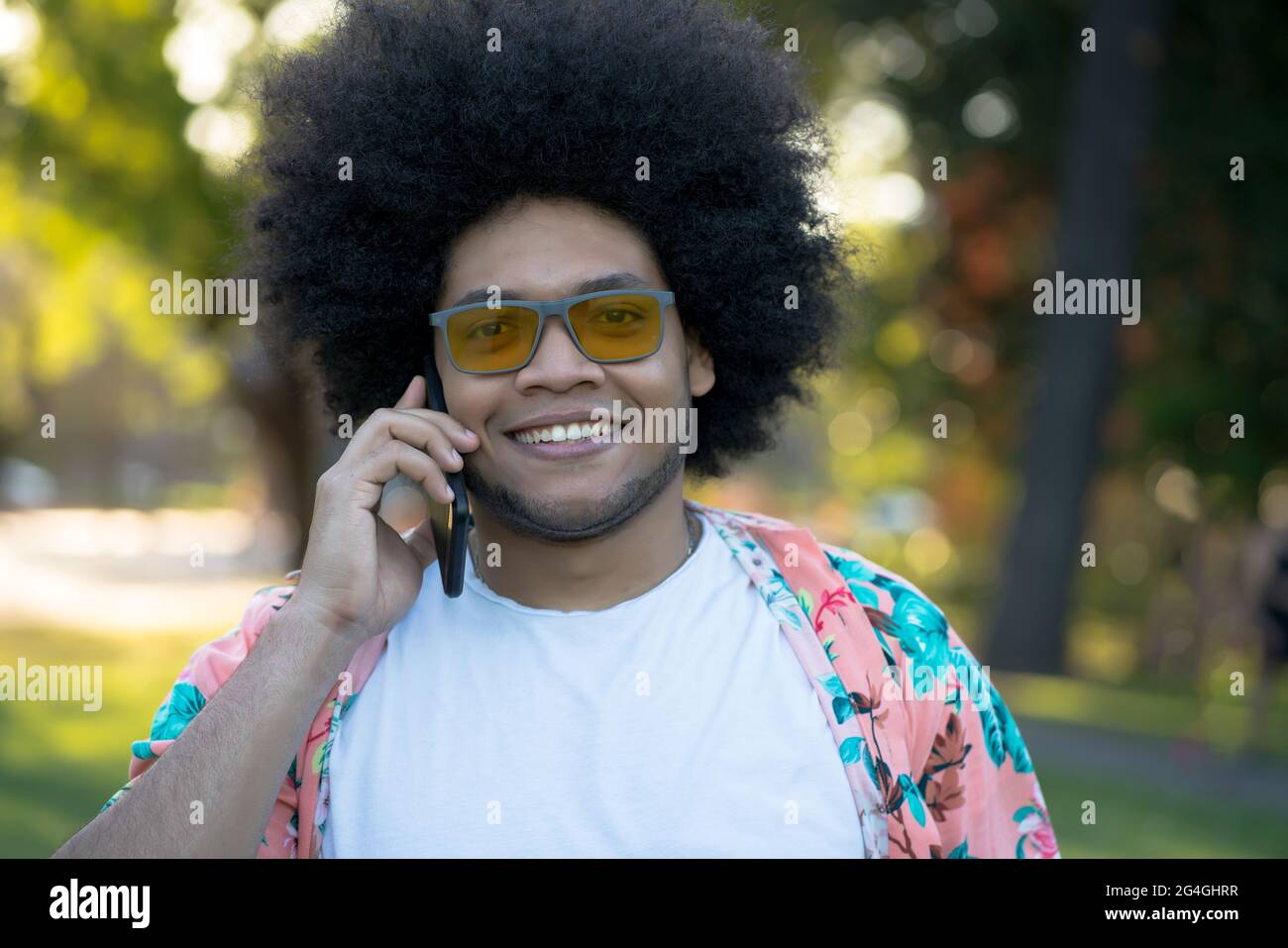 Latin man smiling outside hi-res stock photography and images - Alamy