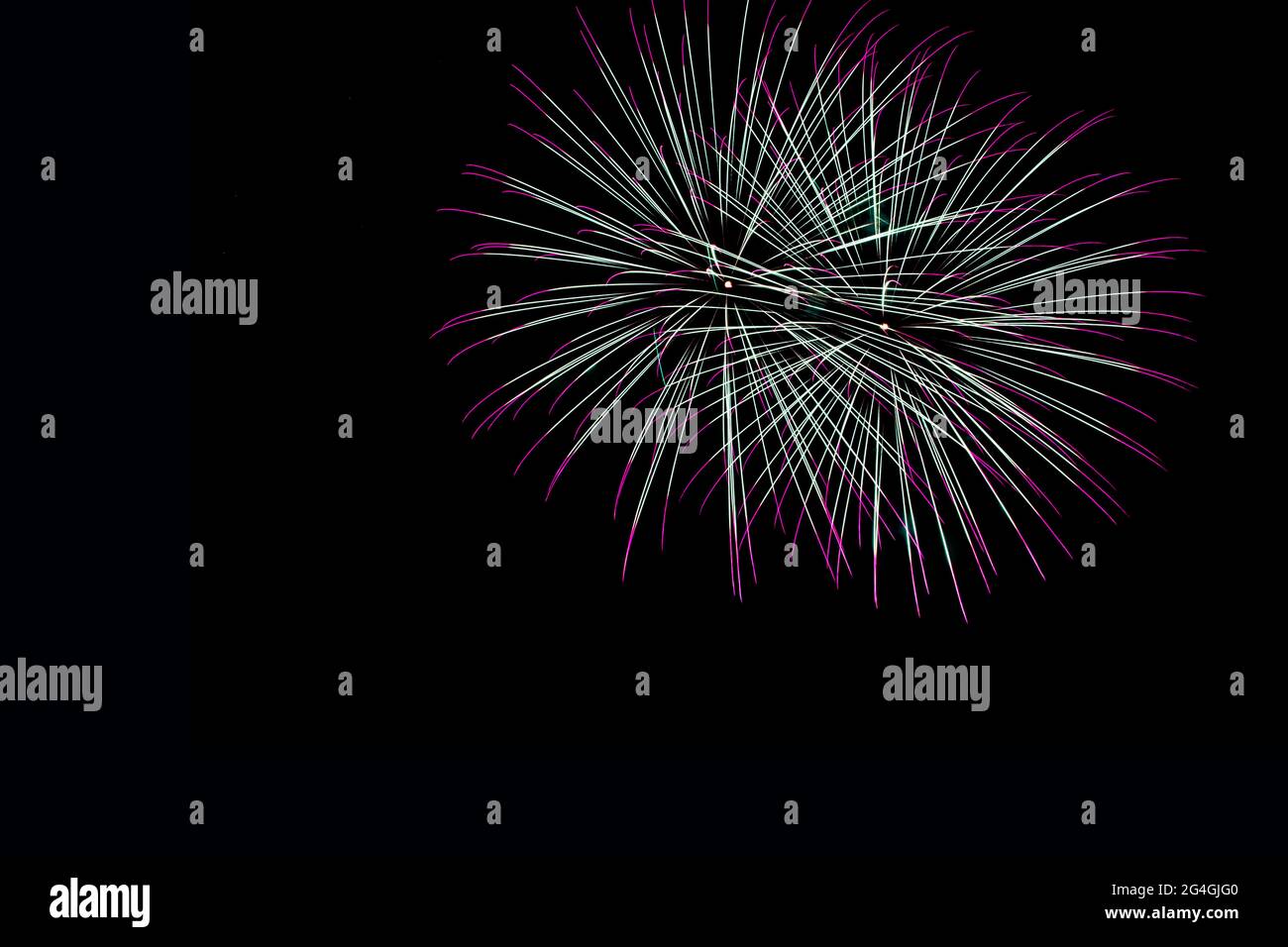 Large fireworks display in a night sky. Colourful explosions isolated ...