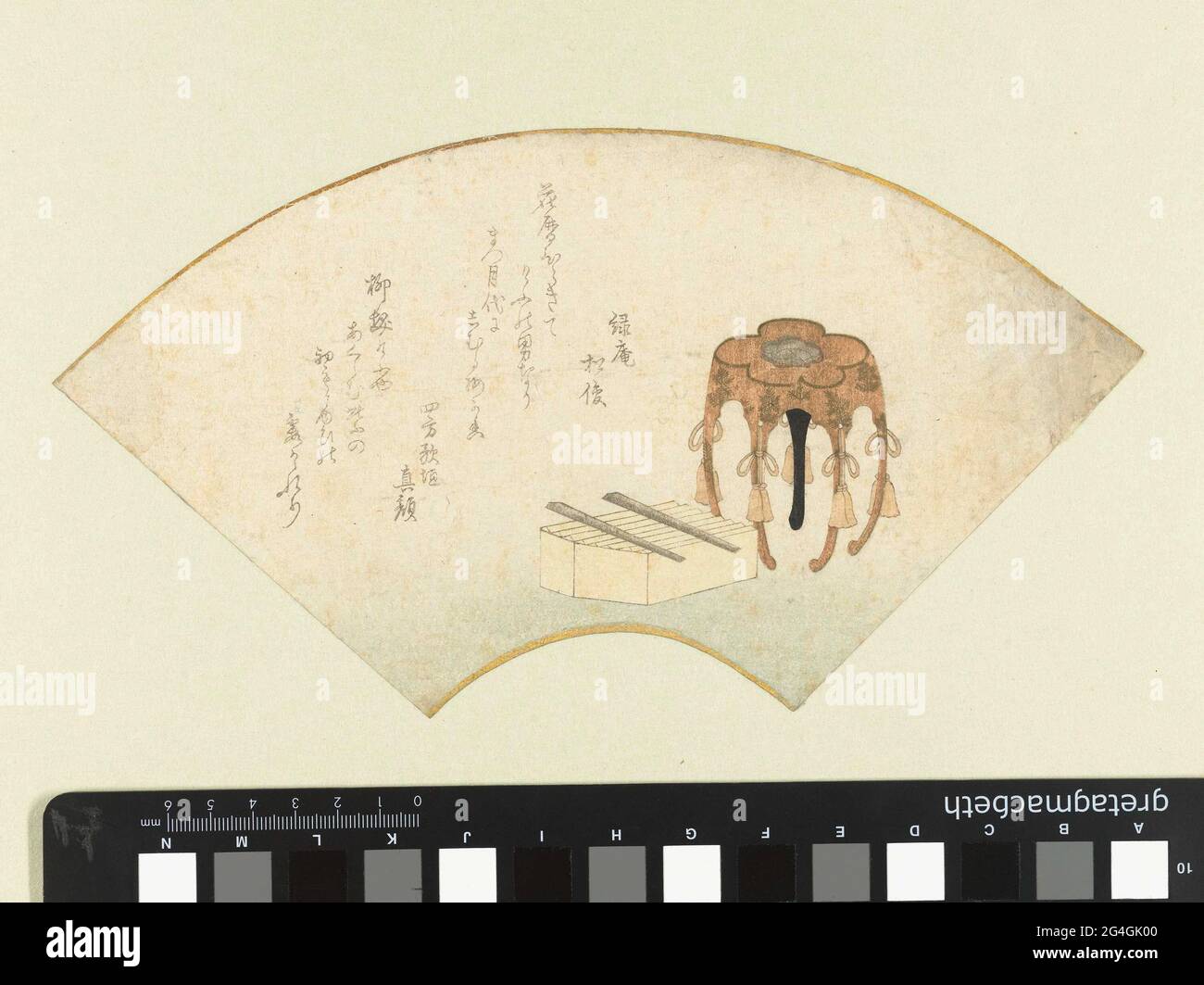 . Range-shaped print with a five-legged lacquered table, with objects ...