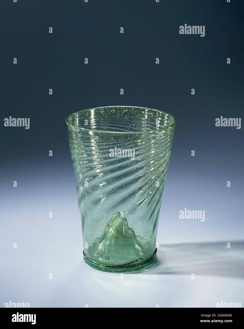 . Cup with deep soil. Smooth stand ring. Conical body, optically blown ...