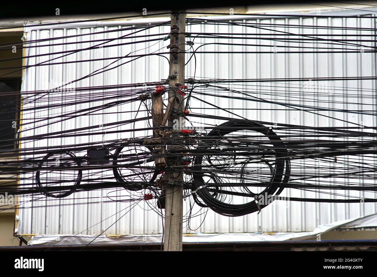 Power lines in the middle of the road Stock Photo - Alamy