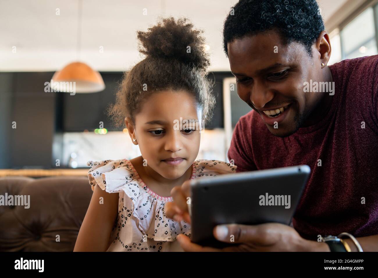 Father children playing tablet hi-res stock photography and images - Alamy