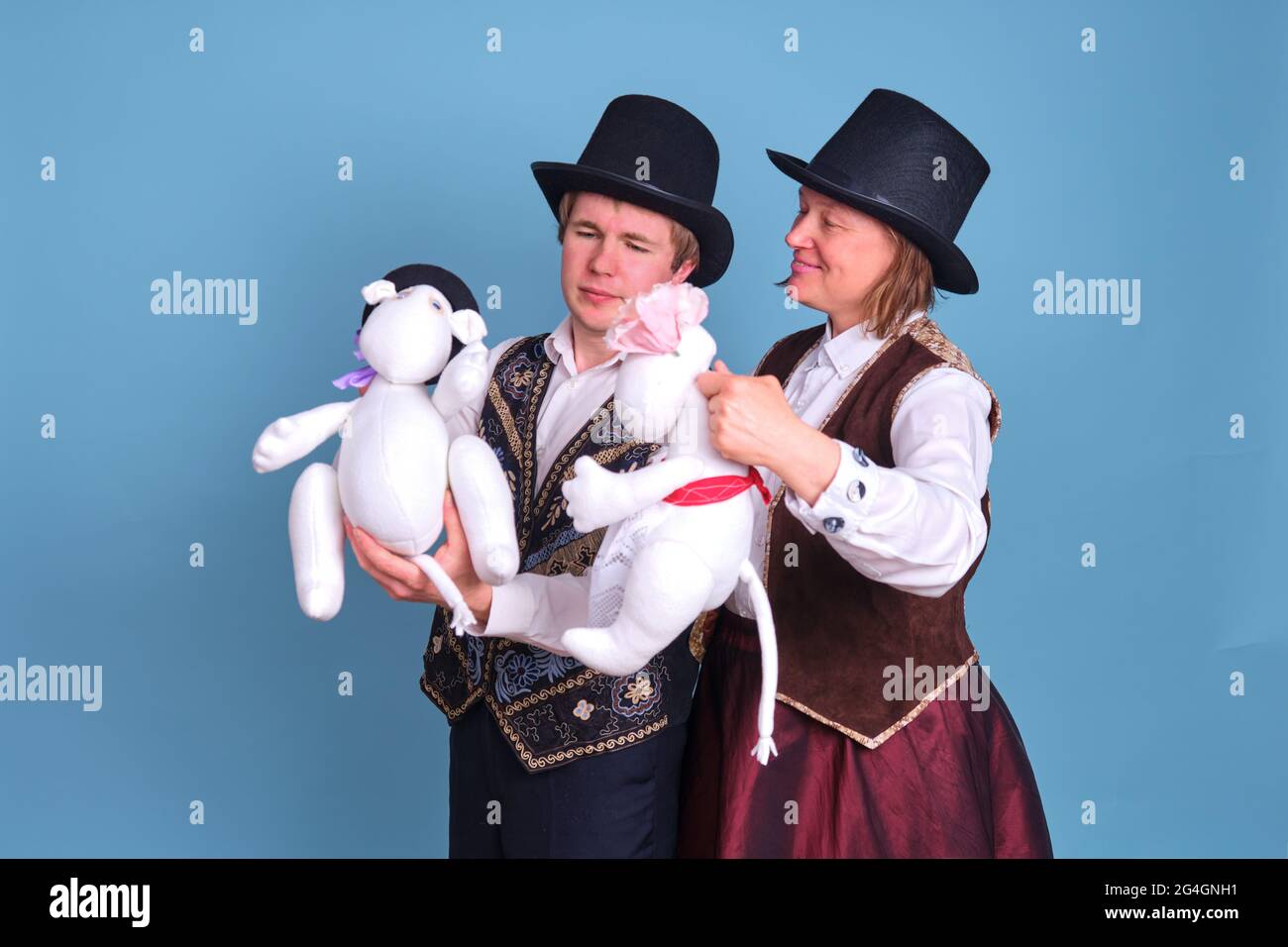 Actors with Moomin troll dolls on a blue background - Moscow, Russia ...