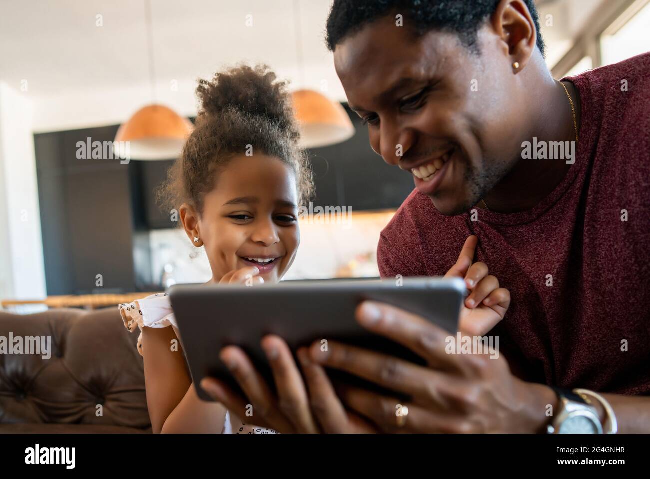 Portrait happy father daughter tablet hi-res stock photography and ...