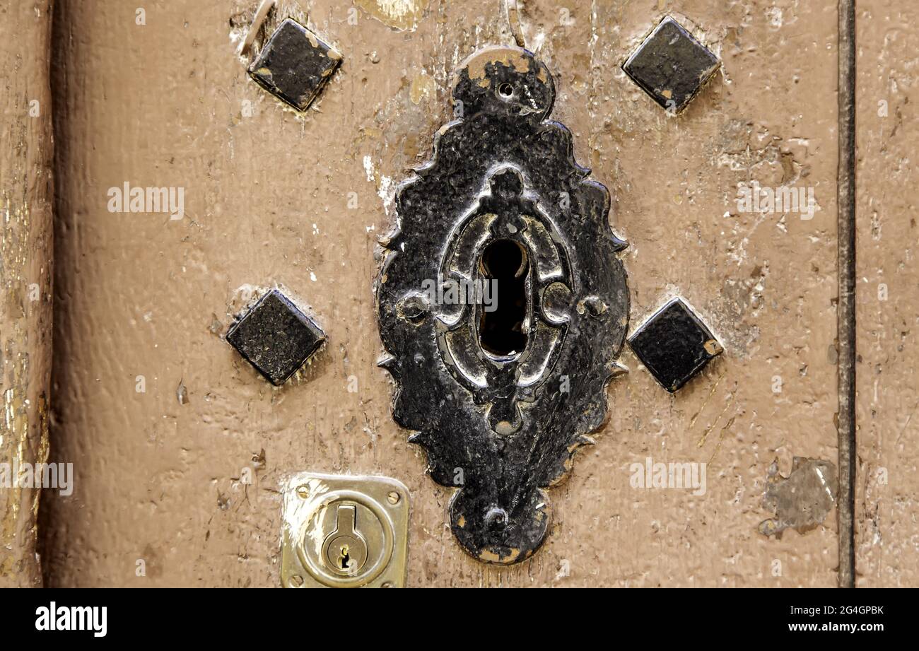 Detail of old door with decorated lock, history and security Stock ...