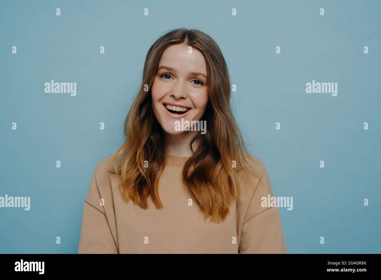 Happy teenage girl looking at camera with positive expression Stock ...