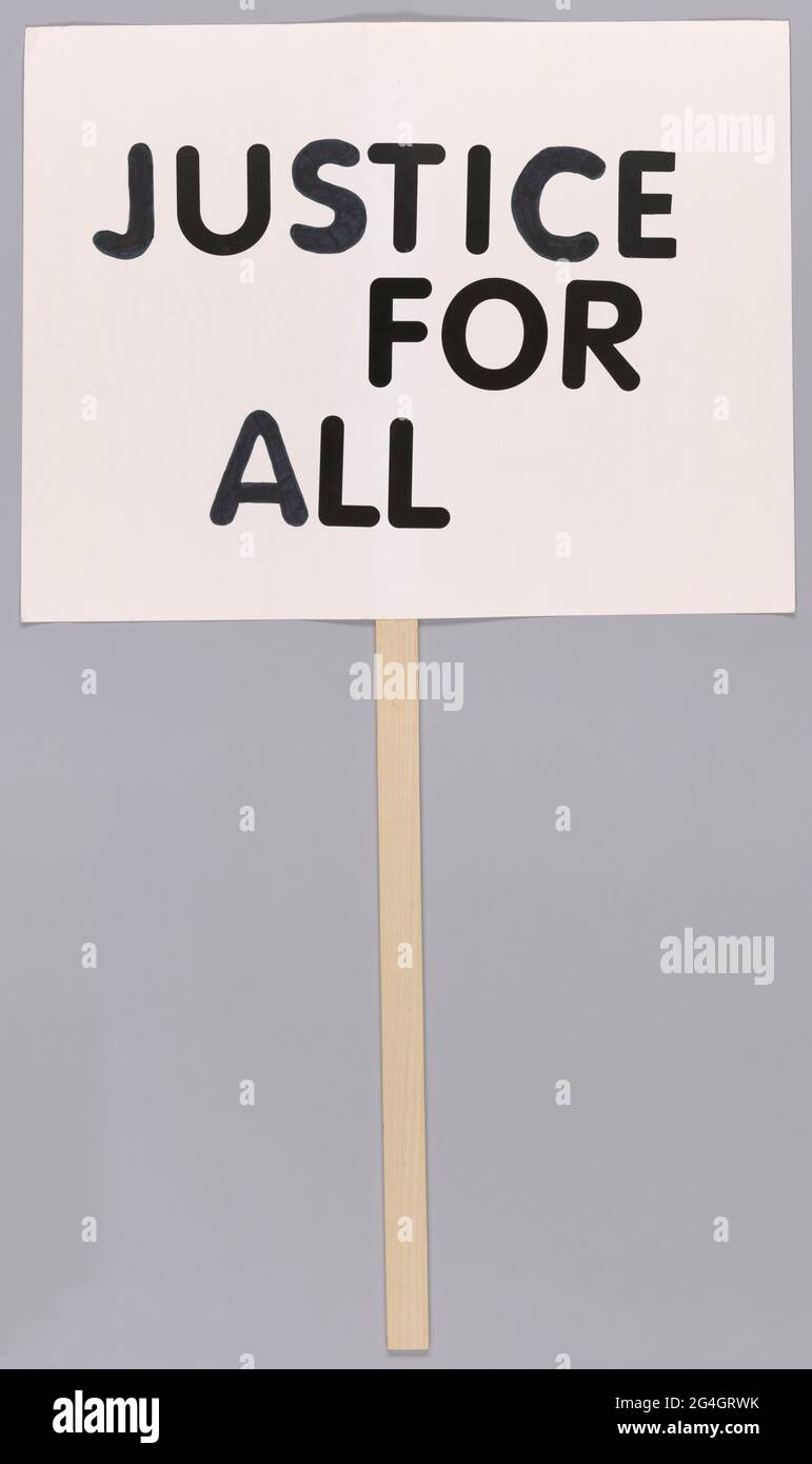 This cardboard sign is a rectangular piece of cardboard with with text ...